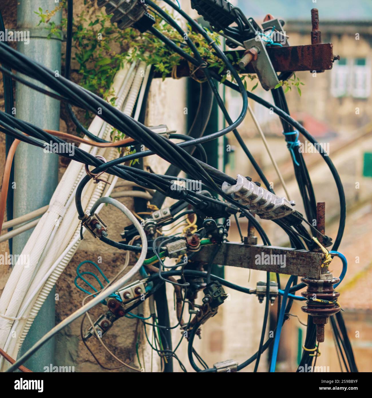 Tangled vintage Electrical Wires on an Outdoor rustic Wall Stock Photo ...