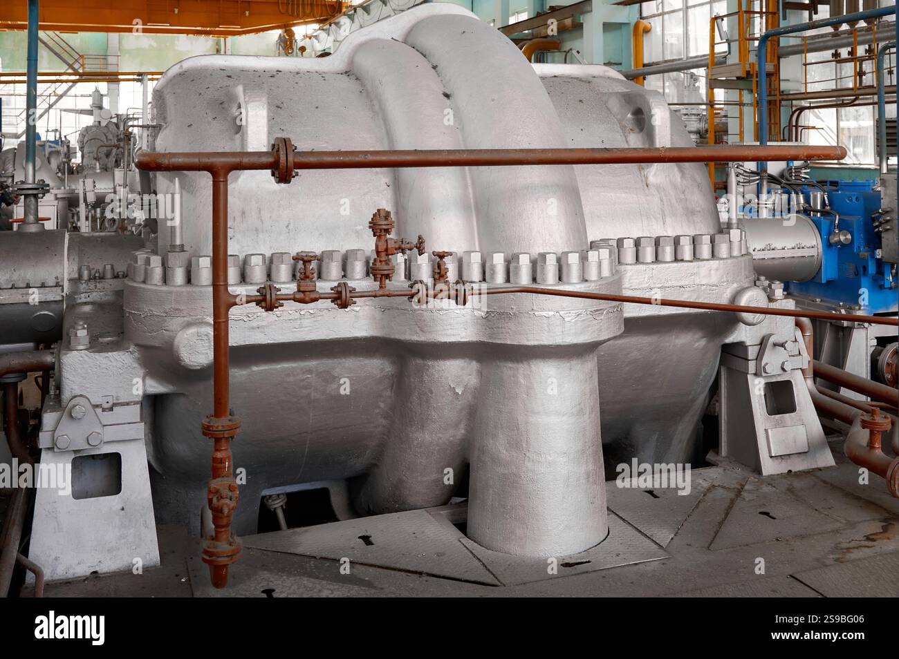 Industrial pump system in a chemical plant during operations focusing ...