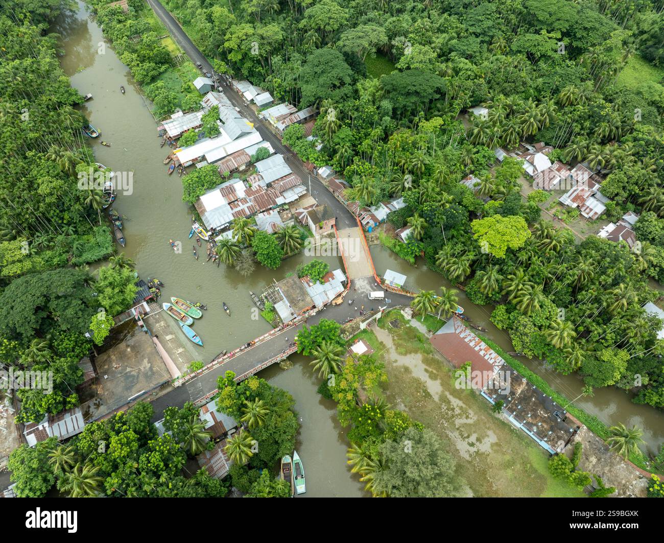Aerial view of a boat sailing at floating guava garden with beautiful green landscape in ...