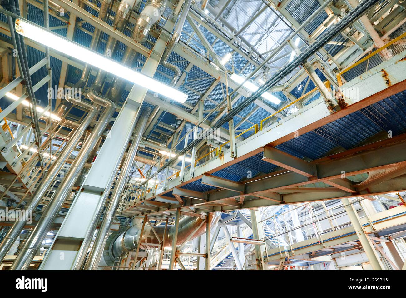 Industrial chemical plant with extensive pipelines and conveyor systems ...