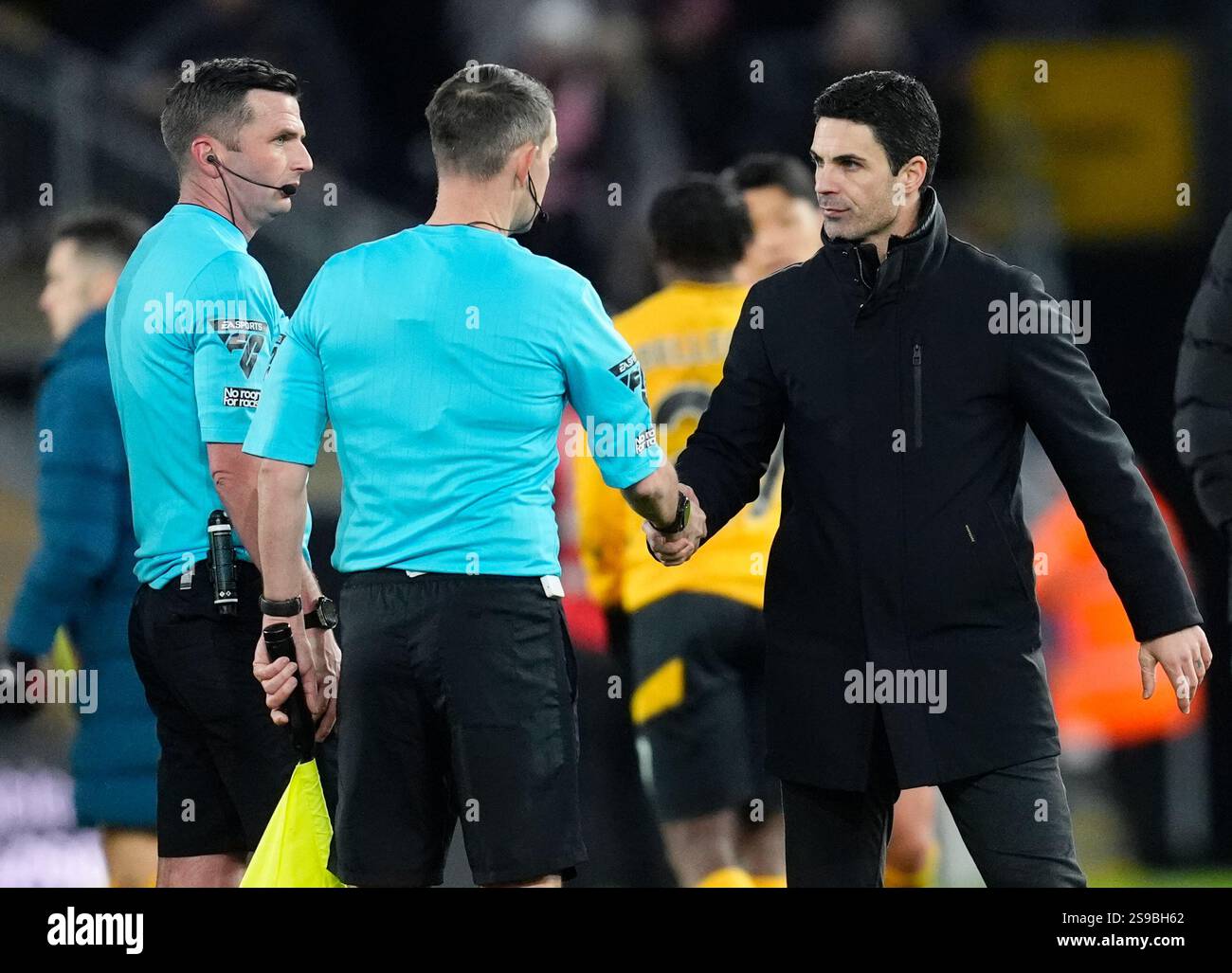 Arsenal manager Mikel Arteta shakes hands with an assistant referee ...