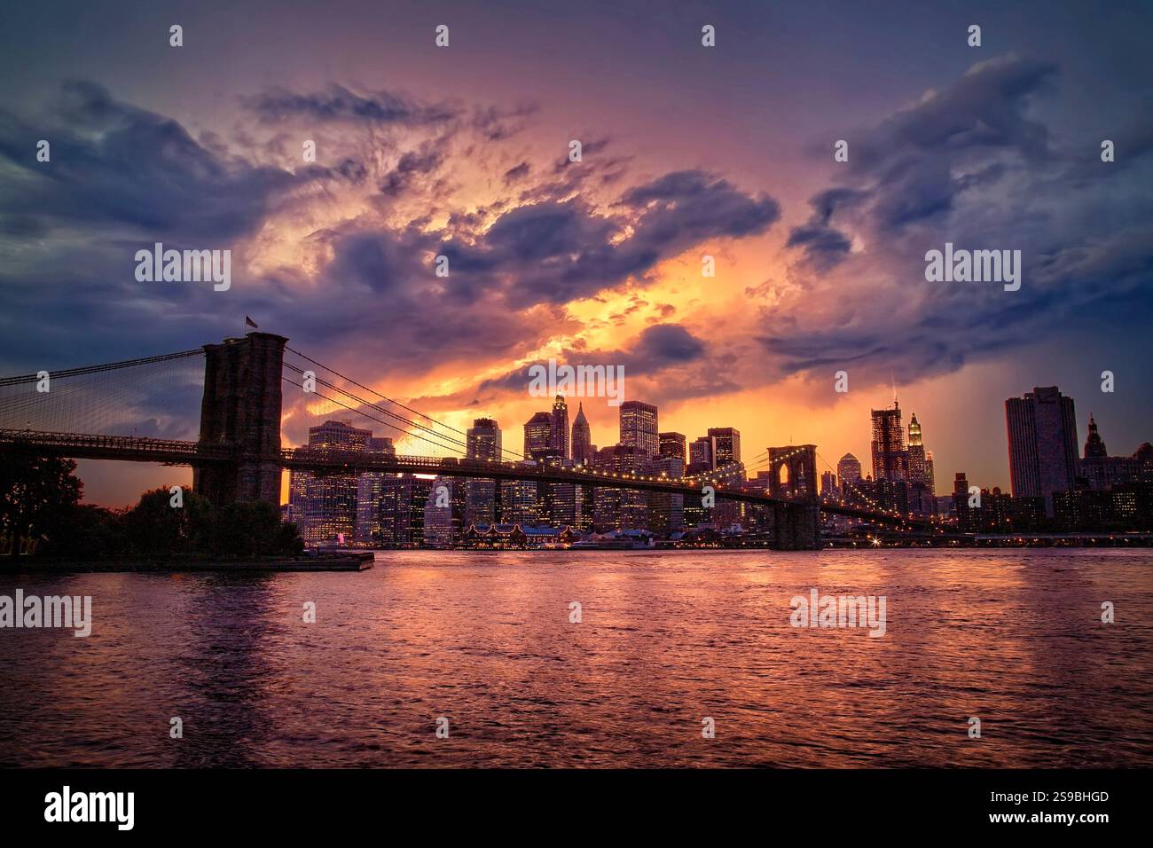 The iconic Brooklyn Bridge gracefully spans the East River, connecting ...