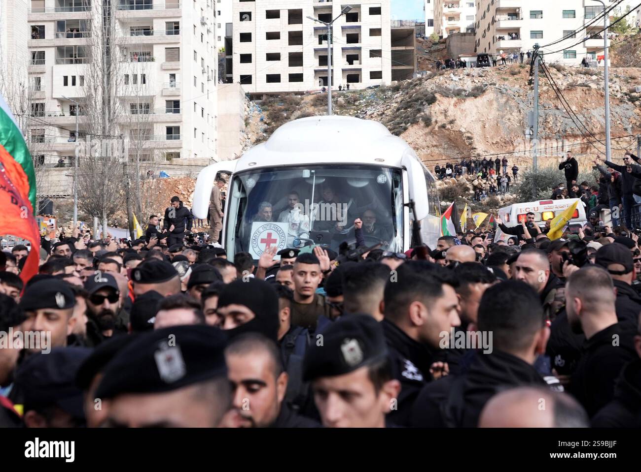 People gather near a bus carrying freed Palestinian prisoners after ...