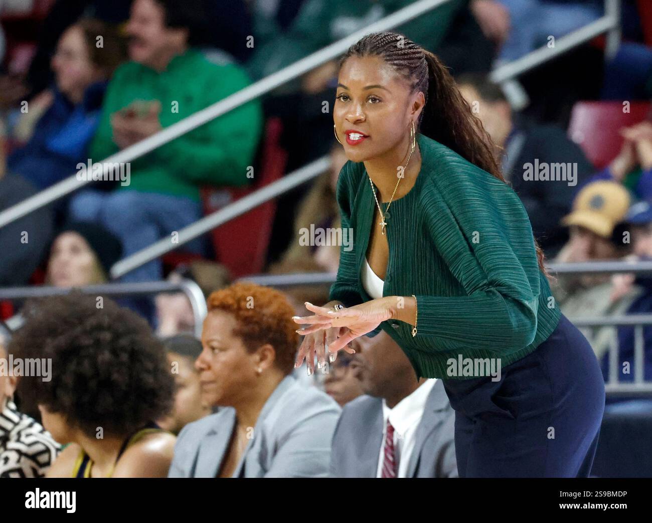 Notre Dame head coach Niele Ivey directs her team from the sideline ...