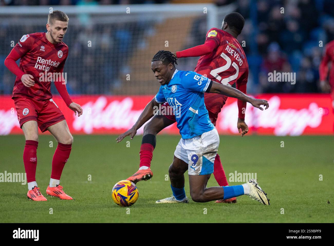 Tanto Olaofe #9 of Stockport County F.C. is fouled by Ade Adeyemo #22 ...