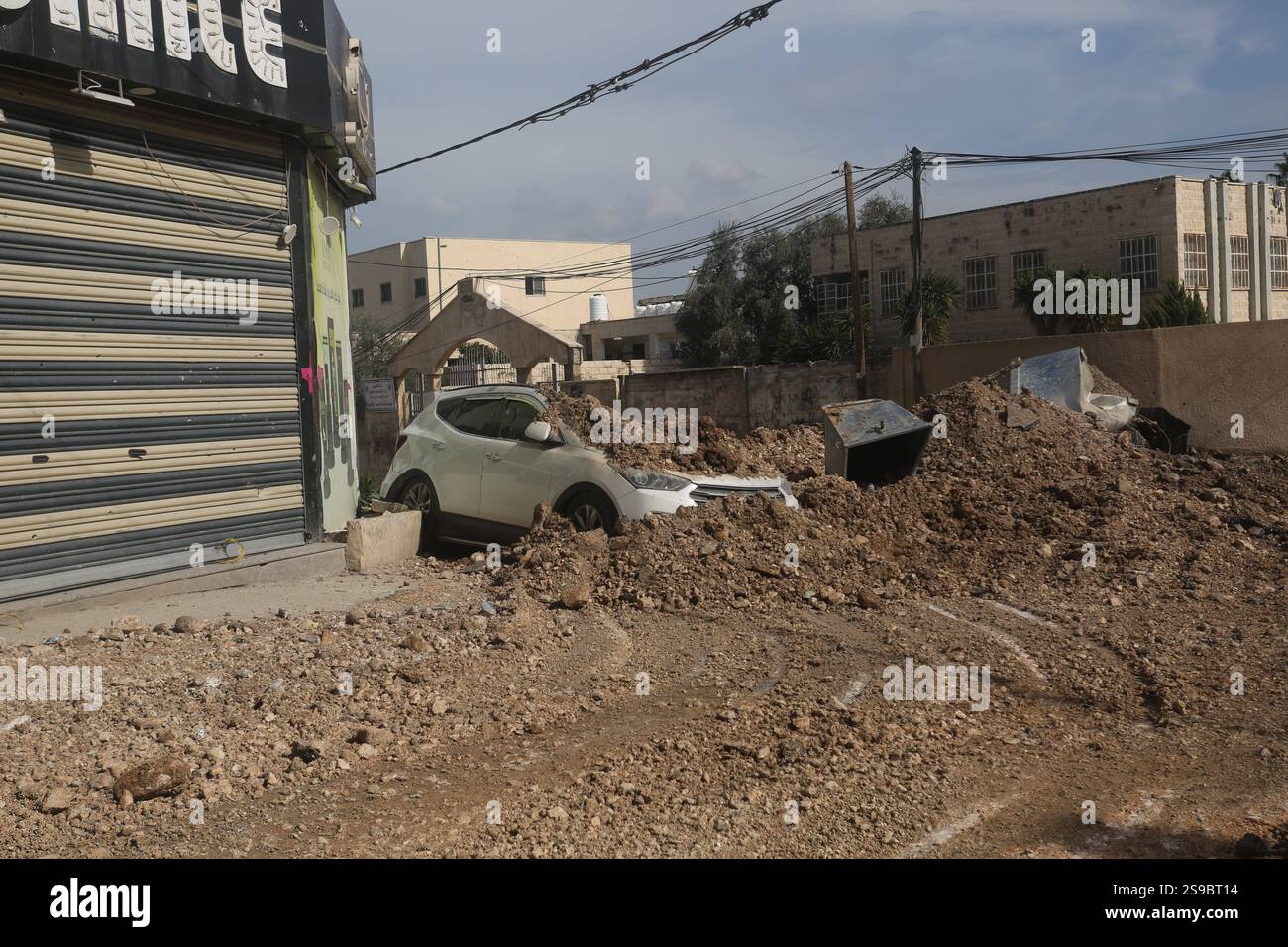Palestinians inspect the destruction after an Israeli military ...