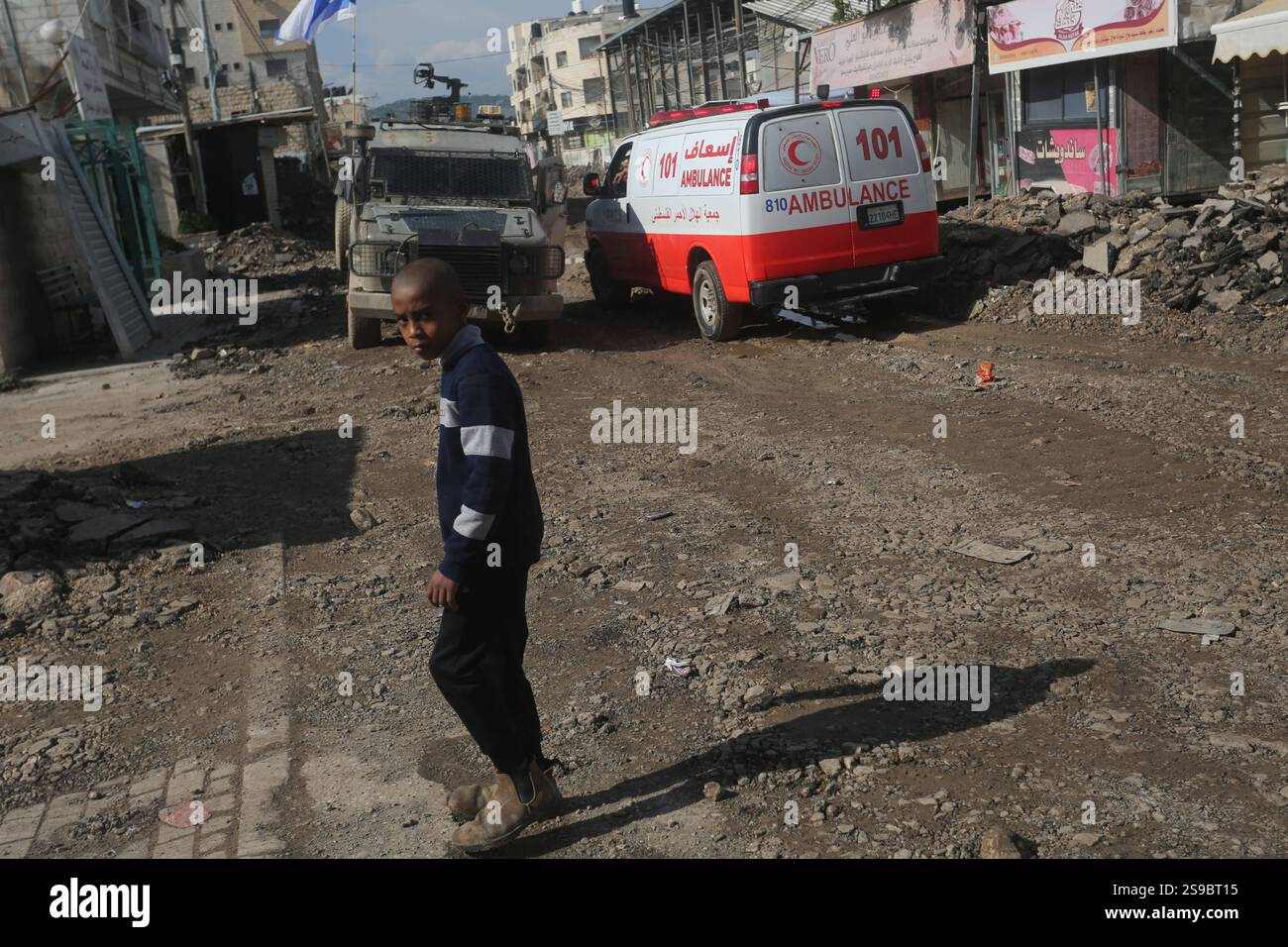 Palestinians inspect the destruction after an Israeli military ...