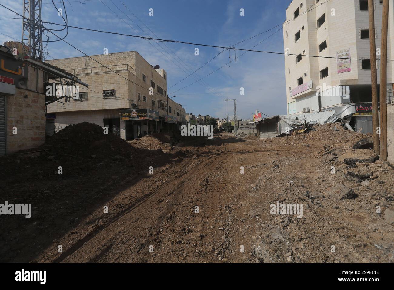 Palestinians inspect the destruction after an Israeli military ...