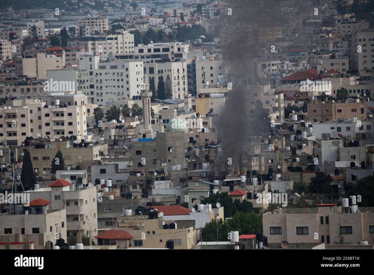 Palestinians inspect the destruction after an Israeli military ...