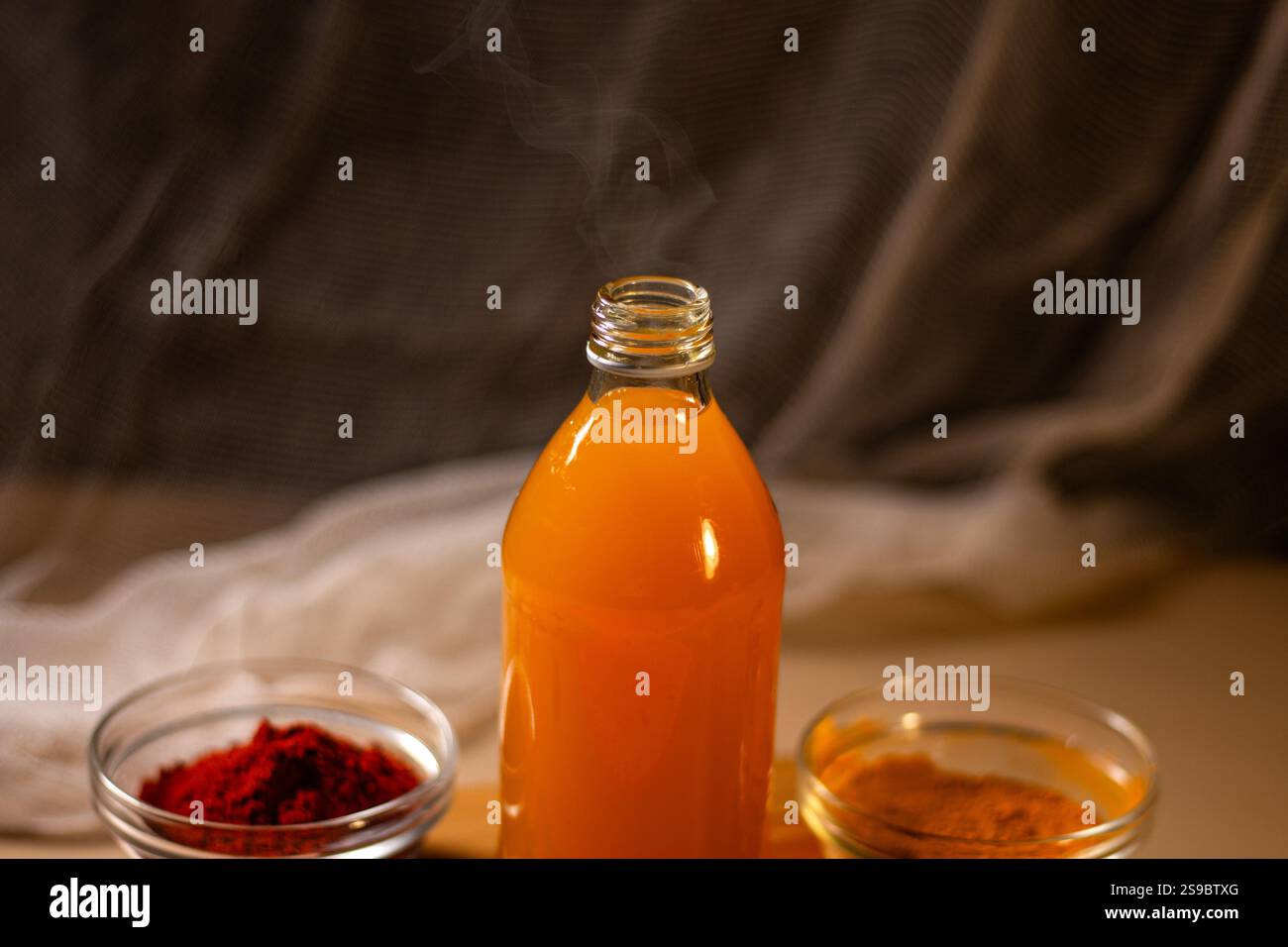 Immunity drink with turmeric powder in bottle. Homemade turmeric tea ...