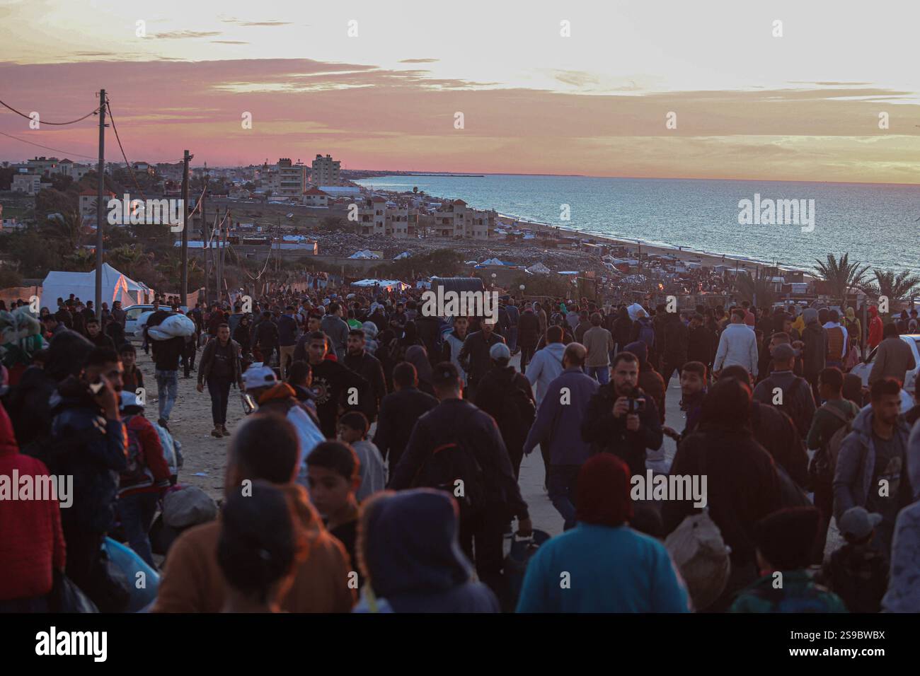 Hundreds of Palestinians gather on Al-Rashid Street, west of the ...