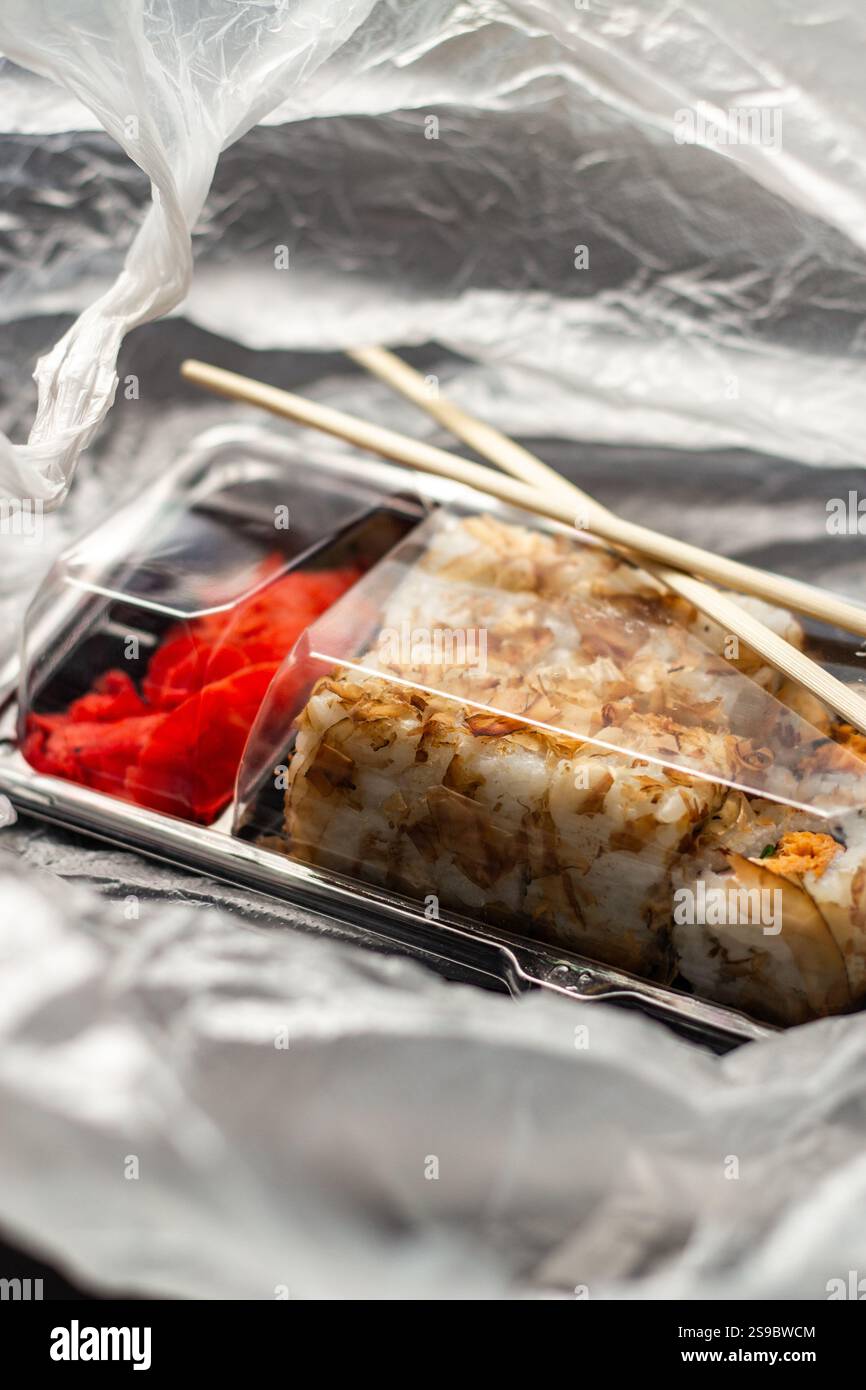 Sushi roll set in take away package in delivery bag. Food delivery ...
