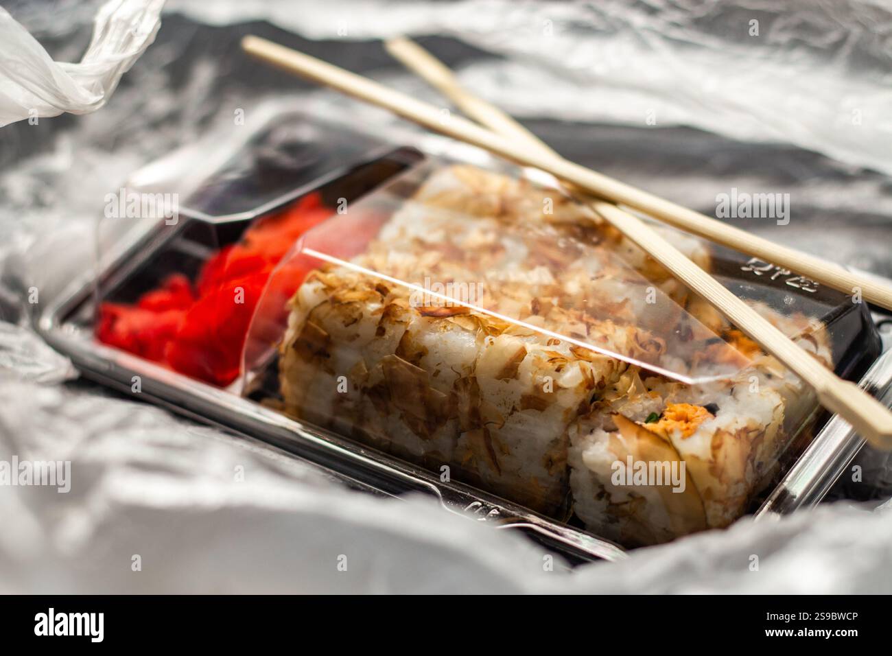 Sushi roll set in take away package in delivery bag. Food delivery ...
