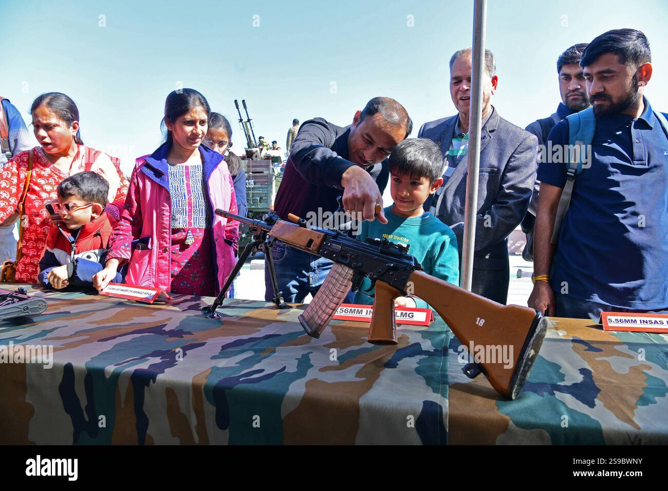 Udaipur, Rajasthan, India, January 25, 2025: Visitors check a rifle ...