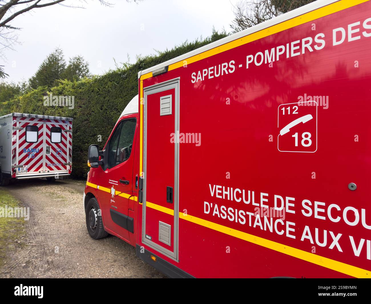 Emergency response vehicles arriving at a rural location during the day ...