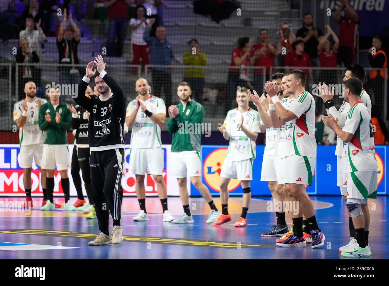 Hungary's players celebrate their victory at the main round match ...