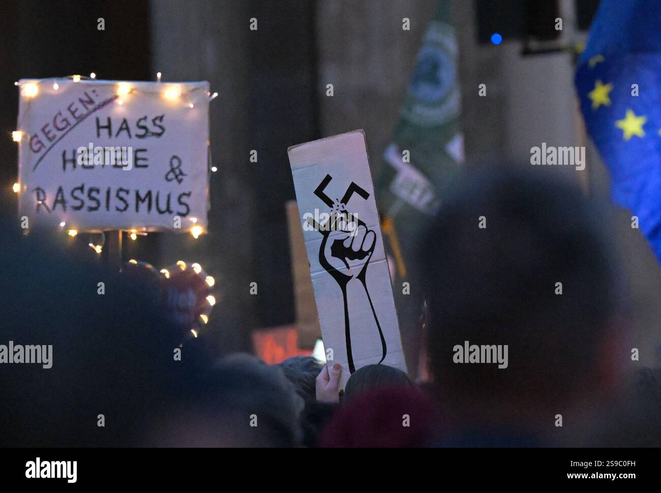 dpatop - 25 January 2025, Berlin: People hold up signs at the "Sea of ...