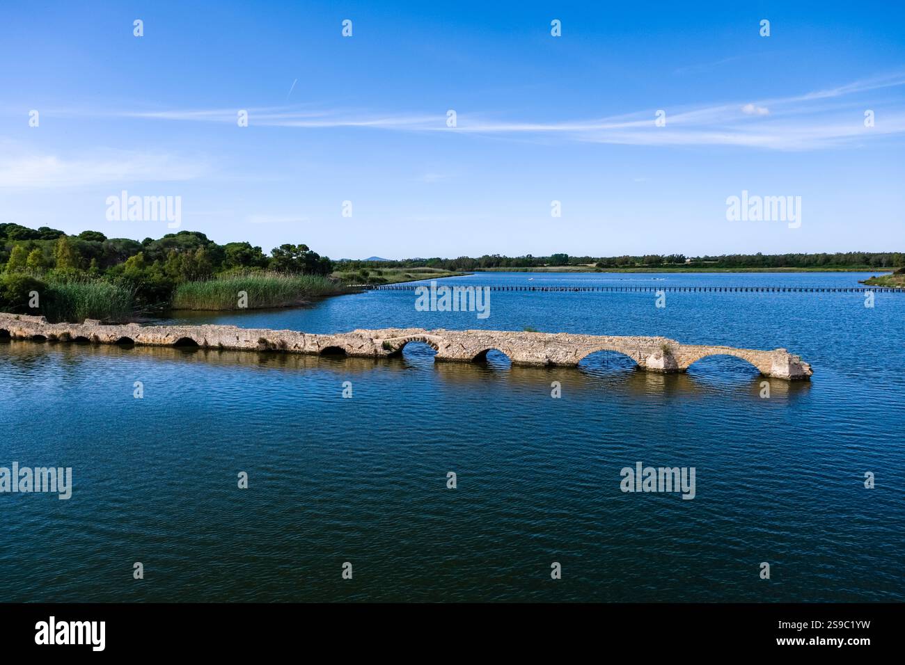 Remains of the restored Ponte Romano di Fertilia bridge, which lies in ...