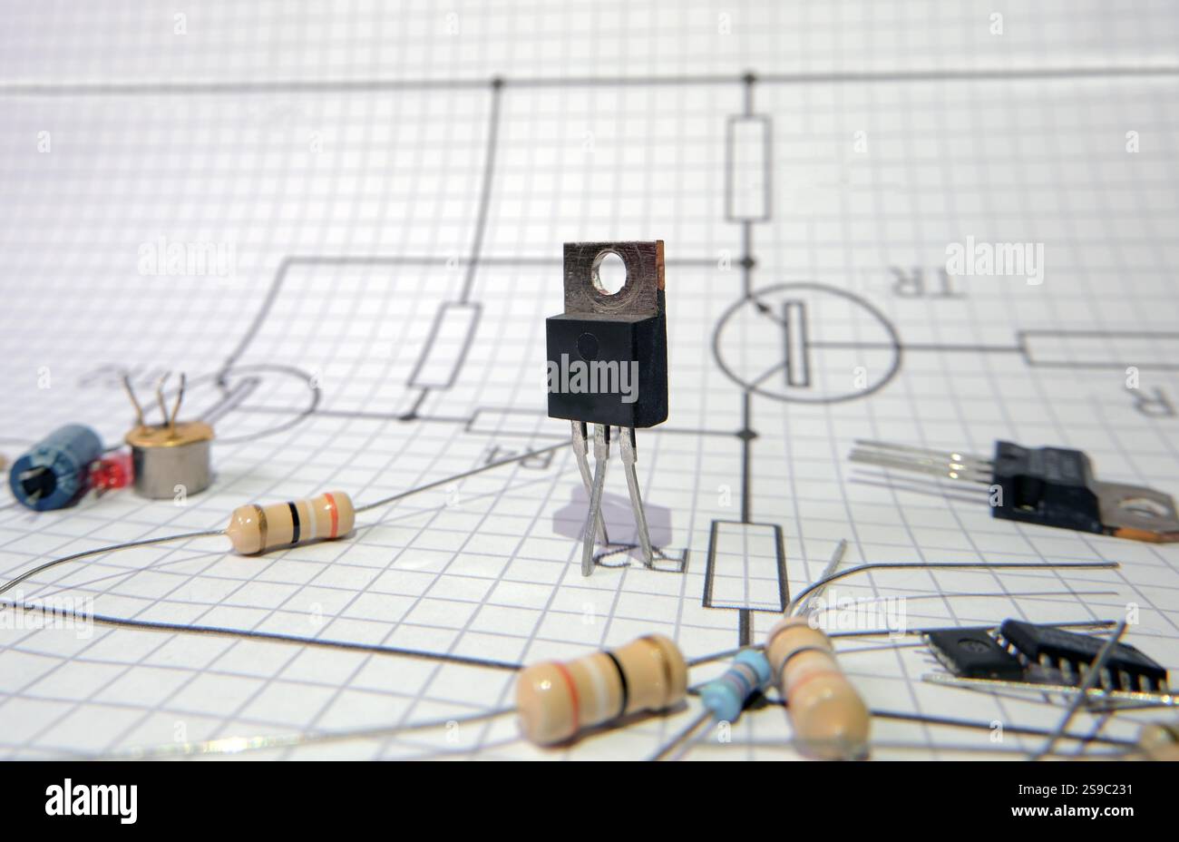 Circuit elements scattered on an electronic circuit diagram. Focused on ...
