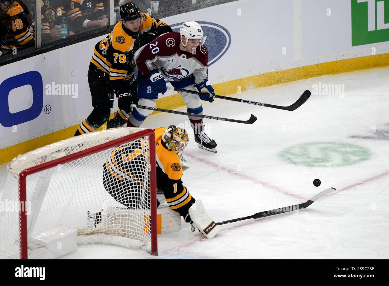 Boston Bruin goalie Jeremy Swayman (1) gets caught behind the net but ...