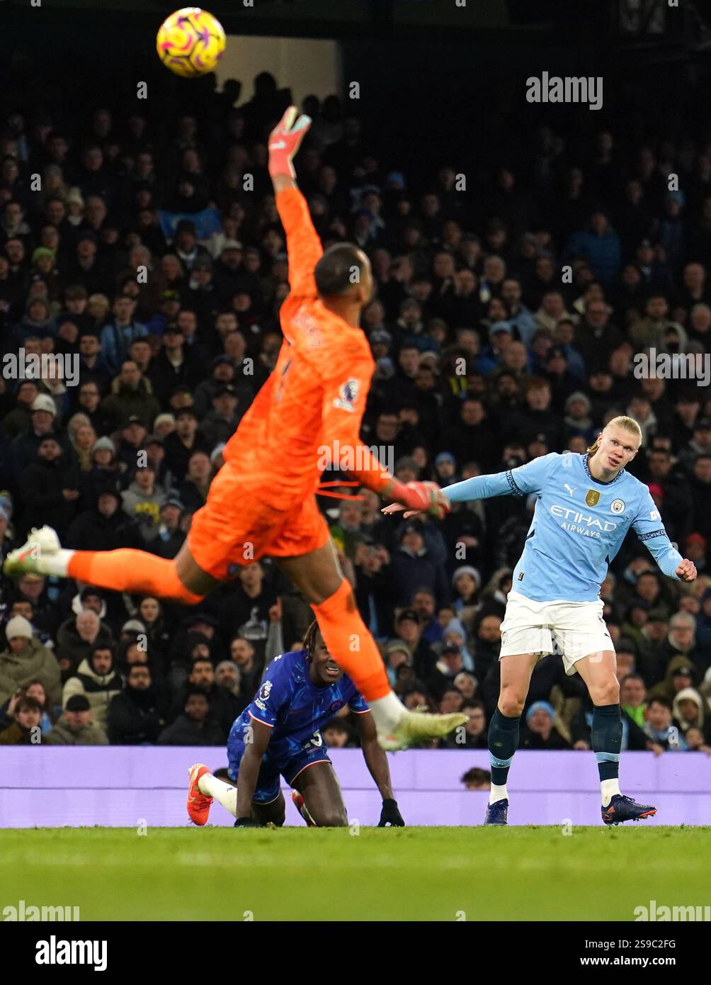 Manchester City's Erling Haaland (right) scores their side's second ...
