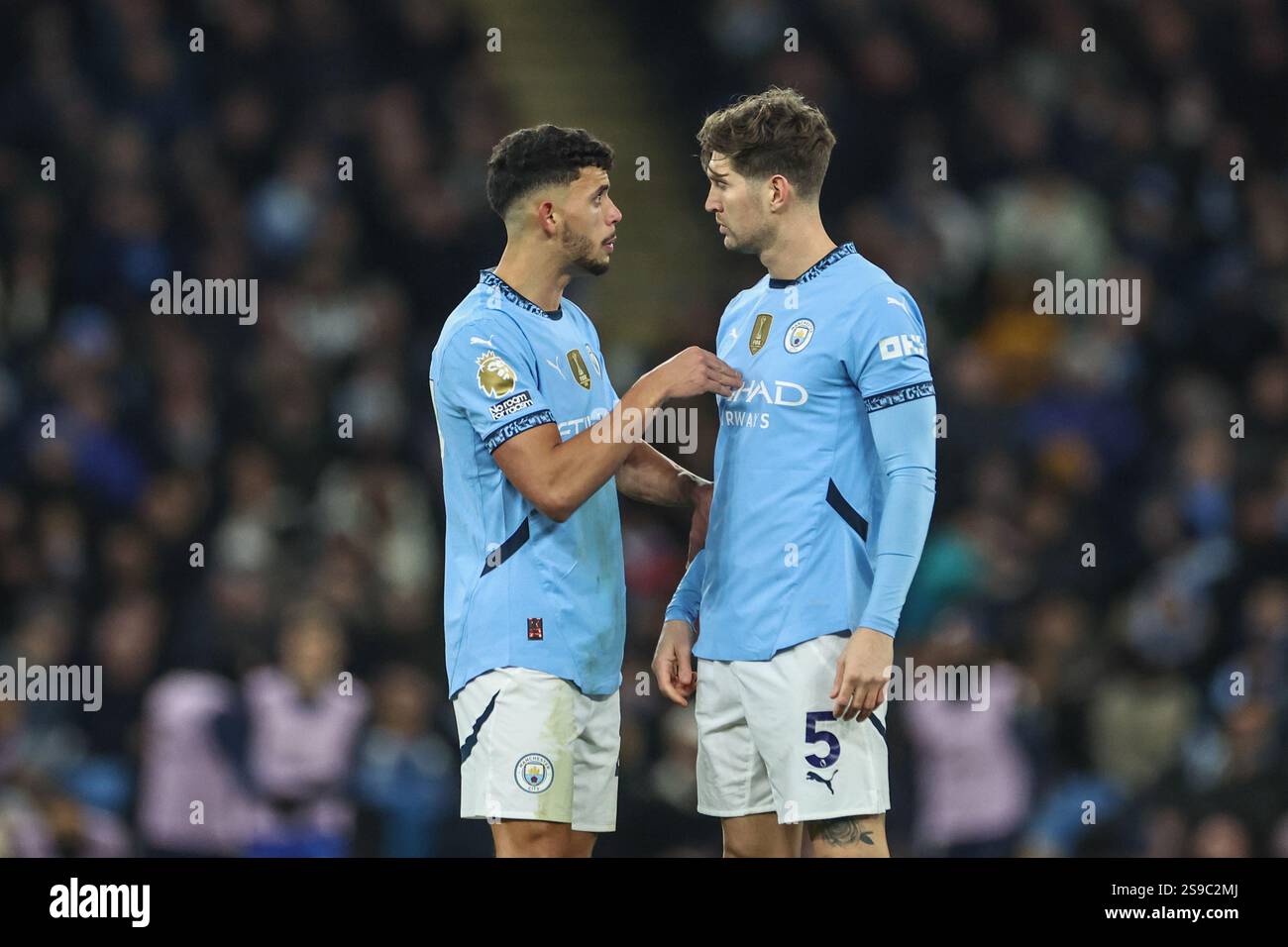 Matheus Nunes of Manchester City speaks to John Stones of Manchester ...