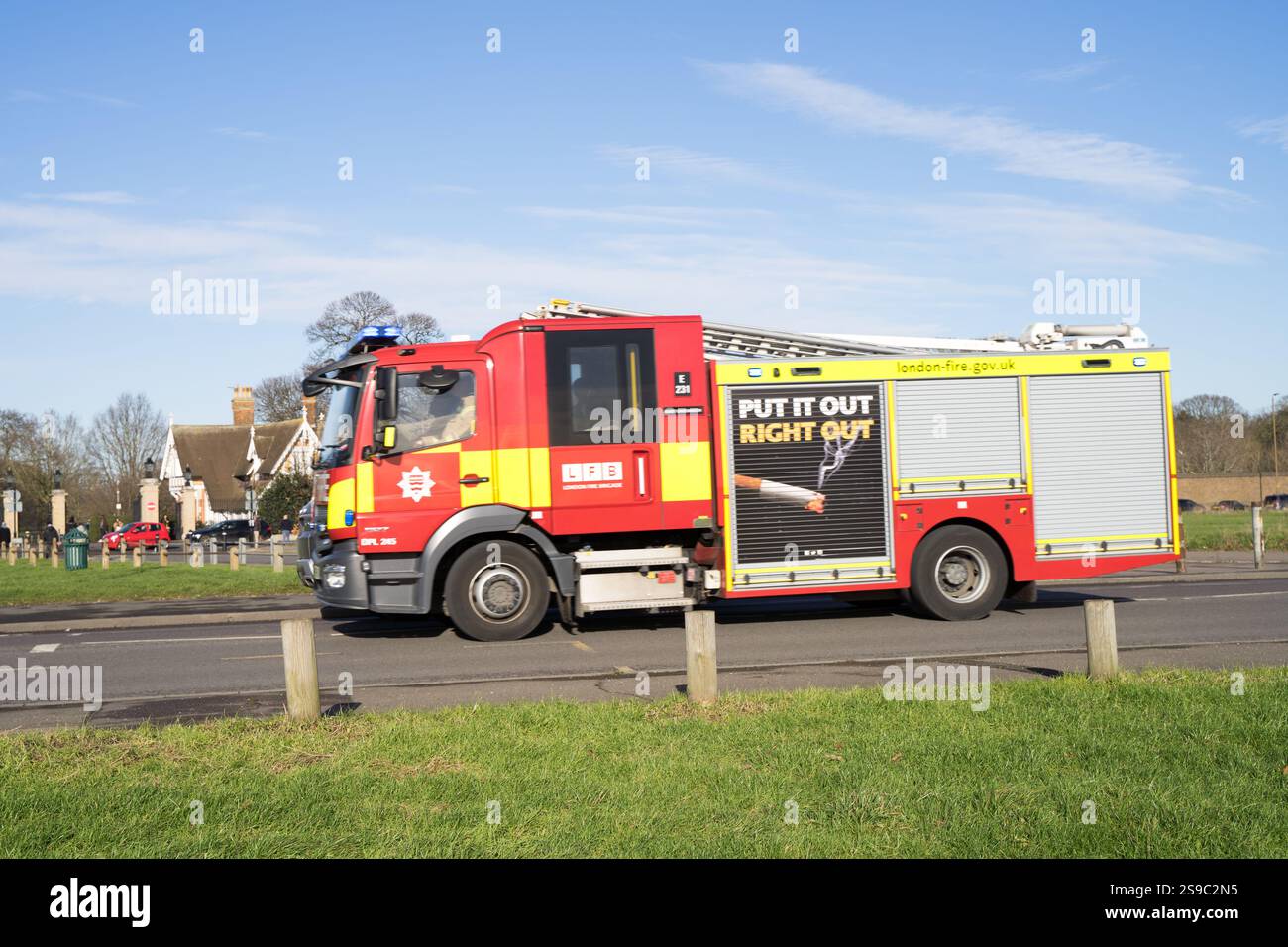side view of London fire brigade fire engine out on the road in ...
