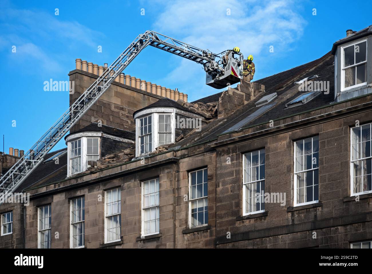 Scottish Fire Service officiers removing debris after a chimney stack ...