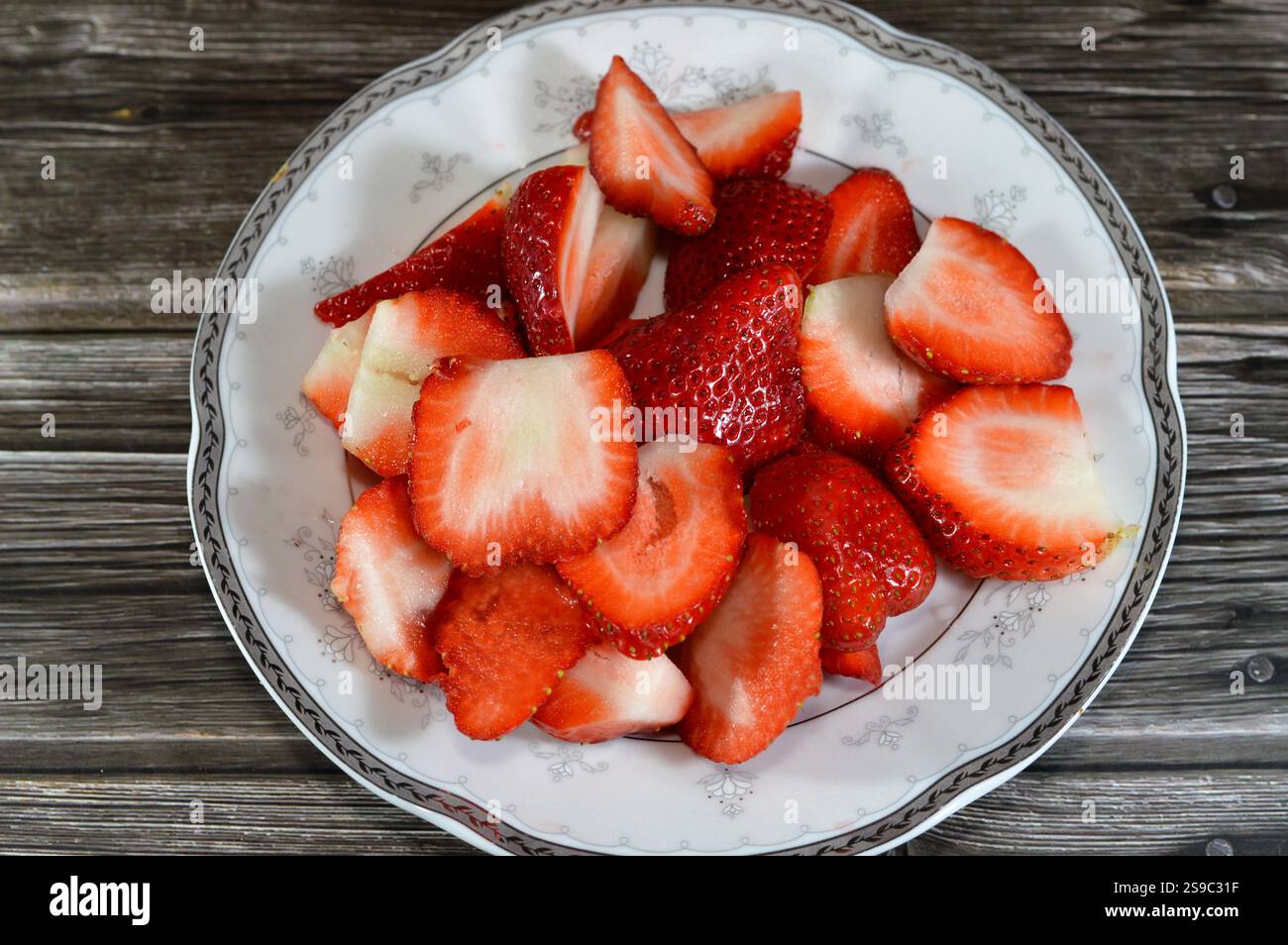 Strawberry fruit, a widely grown hybrid species of the genus Fragaria ...