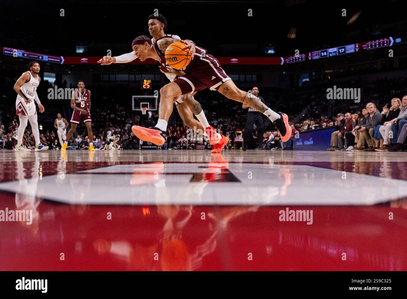 Mississippi State guard Riley Kugel, front, drives on South Carolina ...