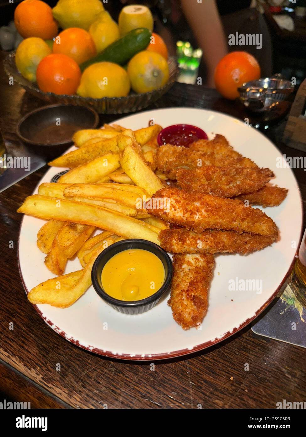 fast food bar meals chicken tenders with potates at pub beer restaurant ...