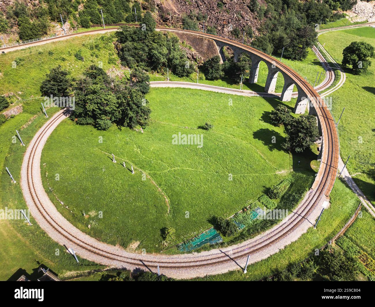 Aerial view of the Brusio spiral viaduct of Rhaetian Railway, Grisons ...