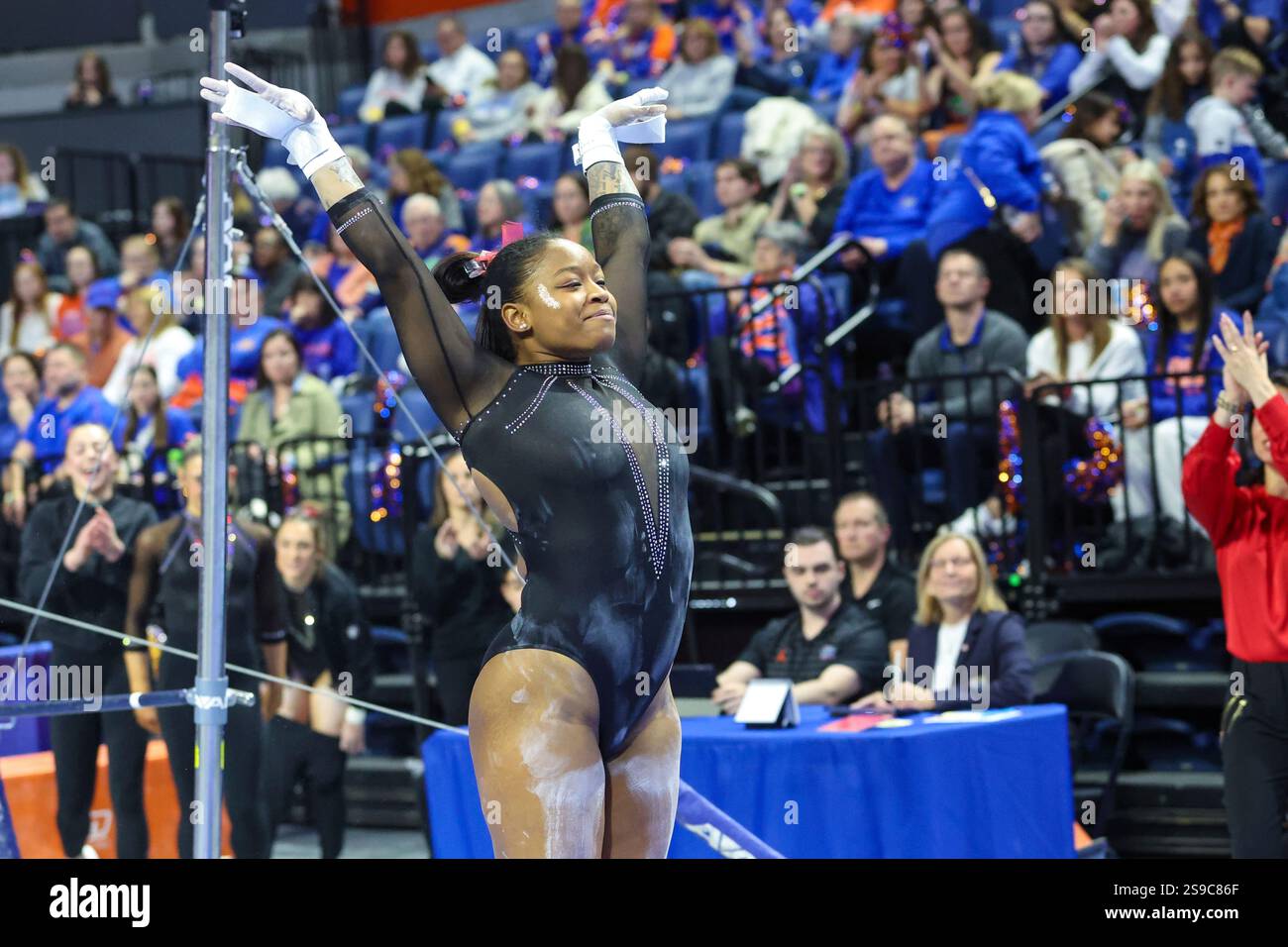 Georgia's Naya Howard competes on the uneven bars during an NCAA ...