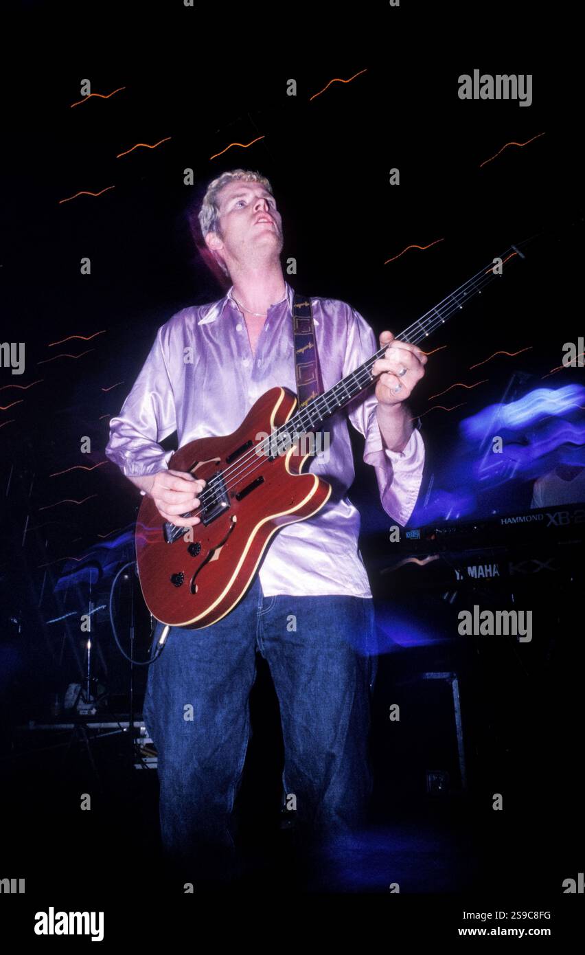 Nigel Clark singer and bass player with Britpop band Dodgy playing at ...
