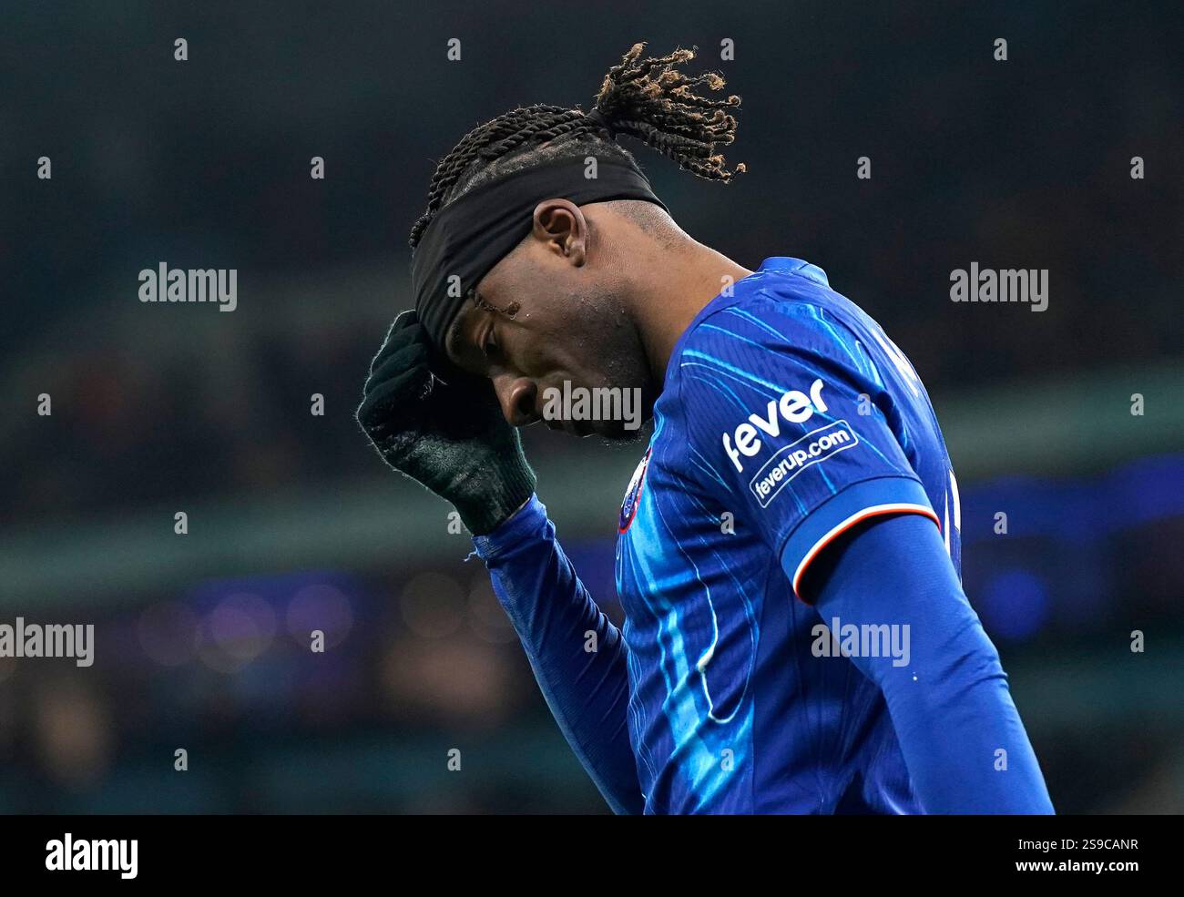 Manchester, England, 25th January 2025. Noni Madueke of Chelsea reacts ...
