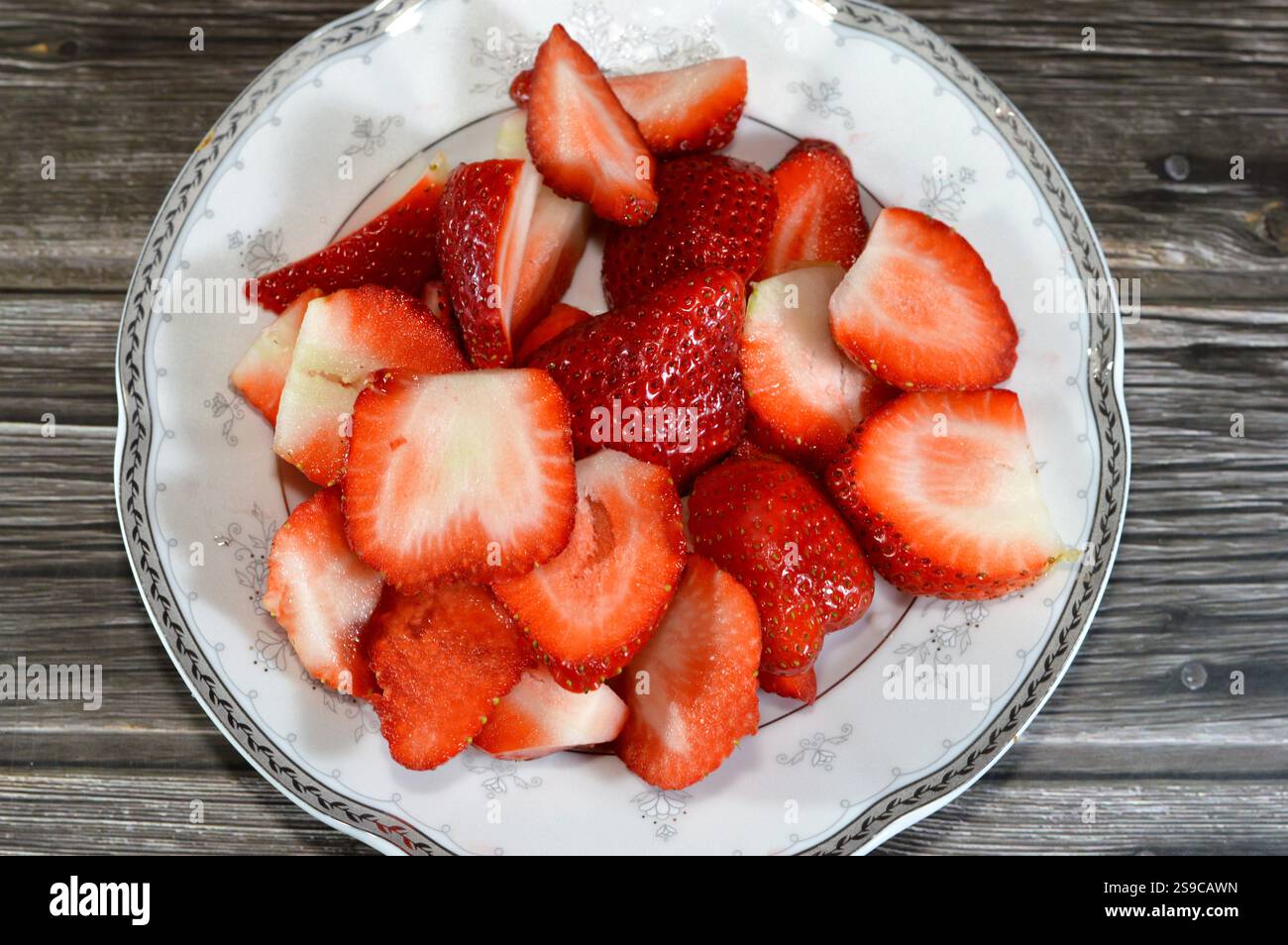 Strawberry fruit, a widely grown hybrid species of the genus Fragaria ...