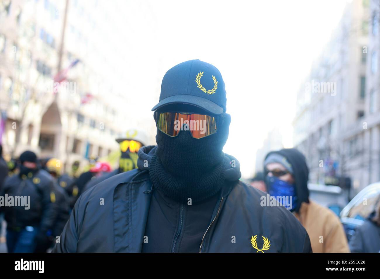 Members of the Proud Boys march after Donald Trump is inaugurated at ...