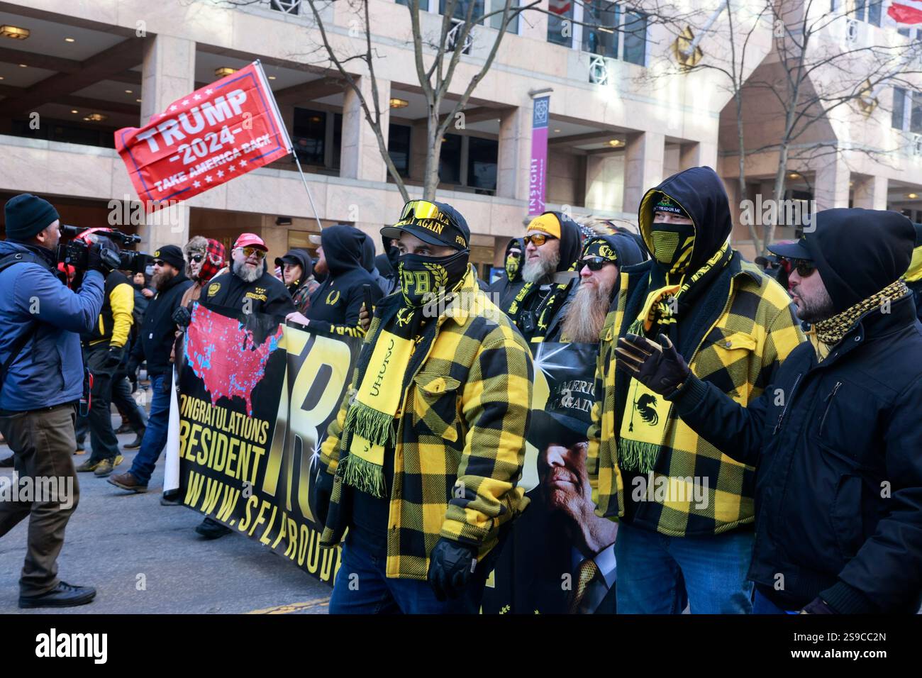 Members of the Proud Boys march after Donald Trump is inaugurated at ...