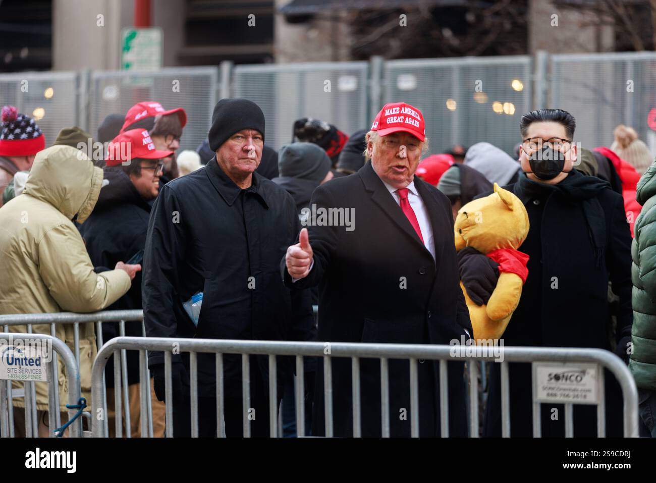 A Trump impersonator gives the thumbs up outside Capital One Arena ...