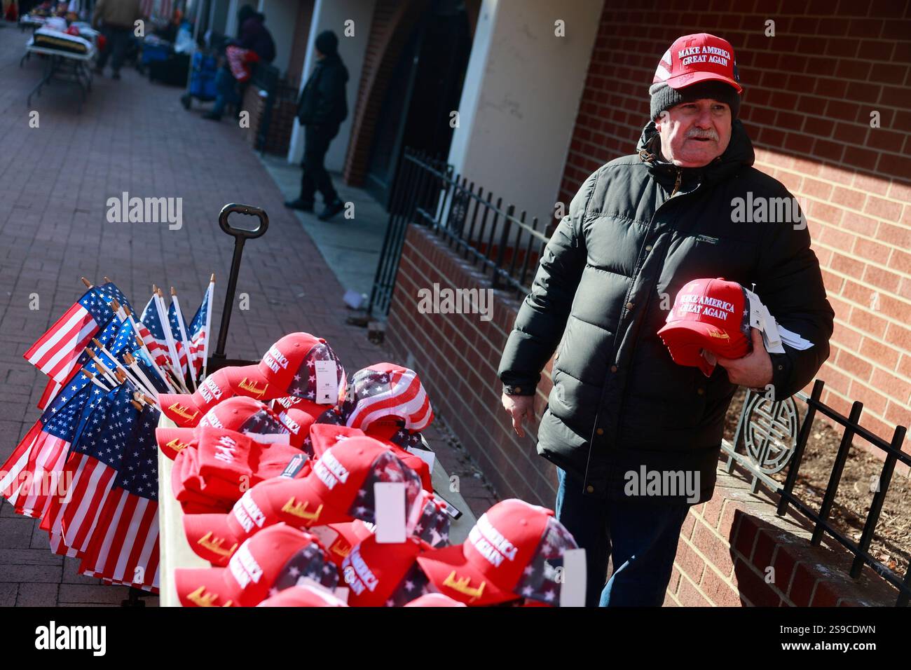 A man sells Donald Trump MAGA hats and other merchandise on ...