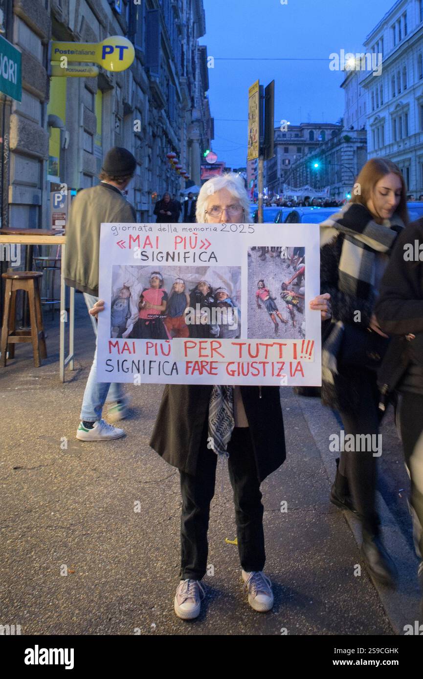 January 25, 2025, Rome, Italy: A protester holds up a sign with photos ...