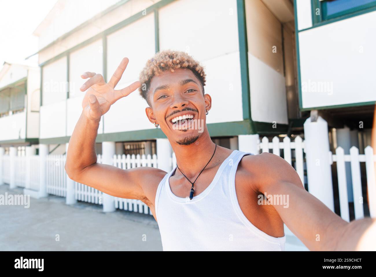Man making peace signs hi-res stock photography and images - Alamy