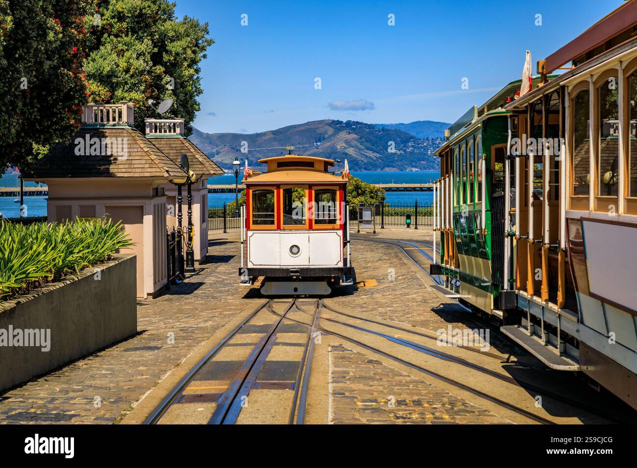 Famous San Francisco cable cars sit on tracks at the Hyde Street ...