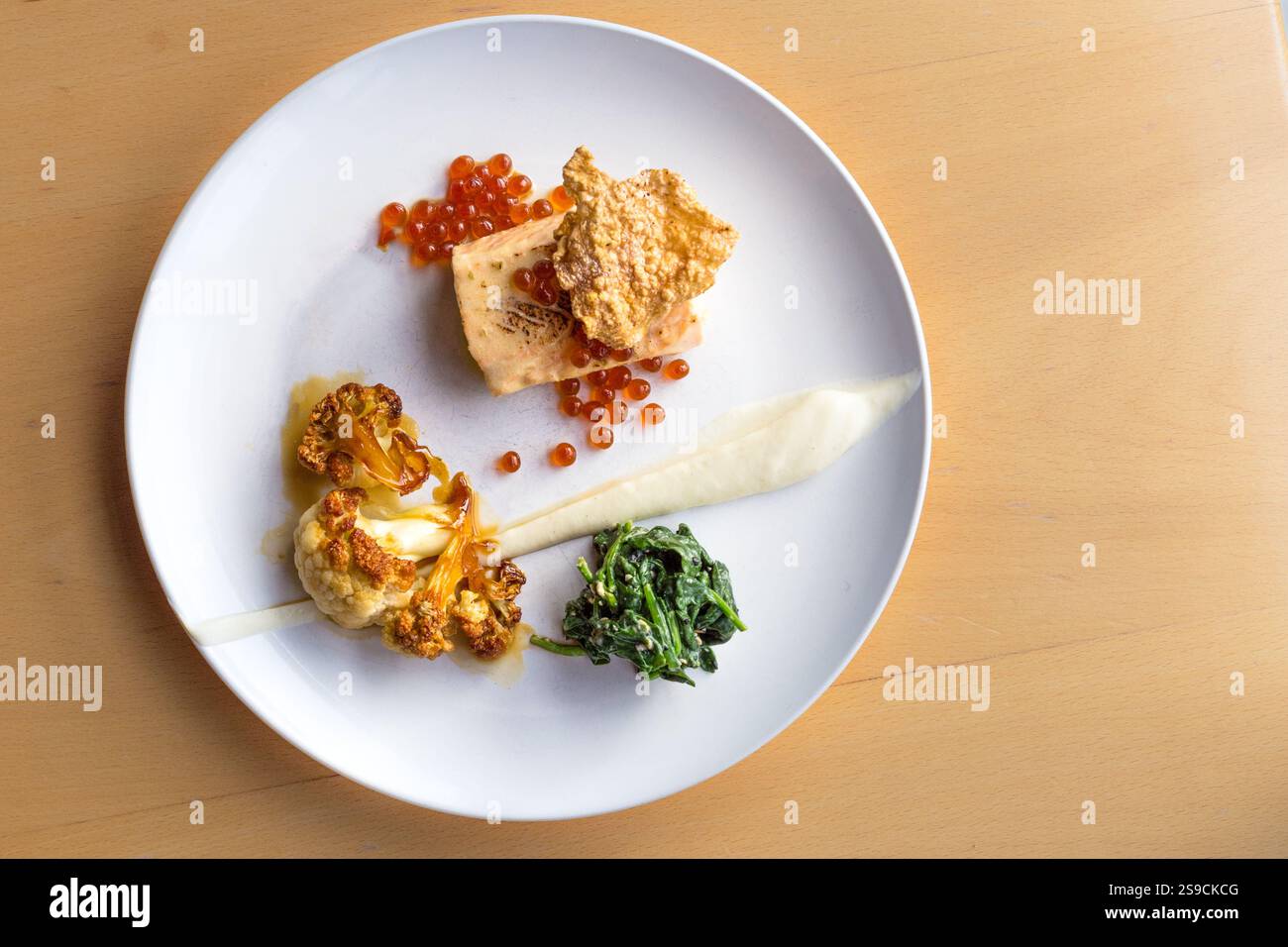 Gourmet Dish Featuring Salmon, Spinach, Cauliflower, and Roe on Elegant ...