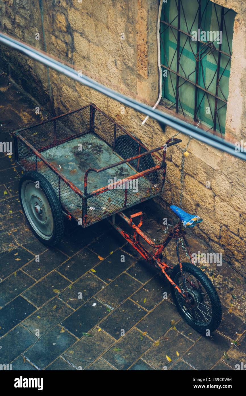 Rusty Cargo Tricycle in Urban Alleyway Stock Photo - Alamy