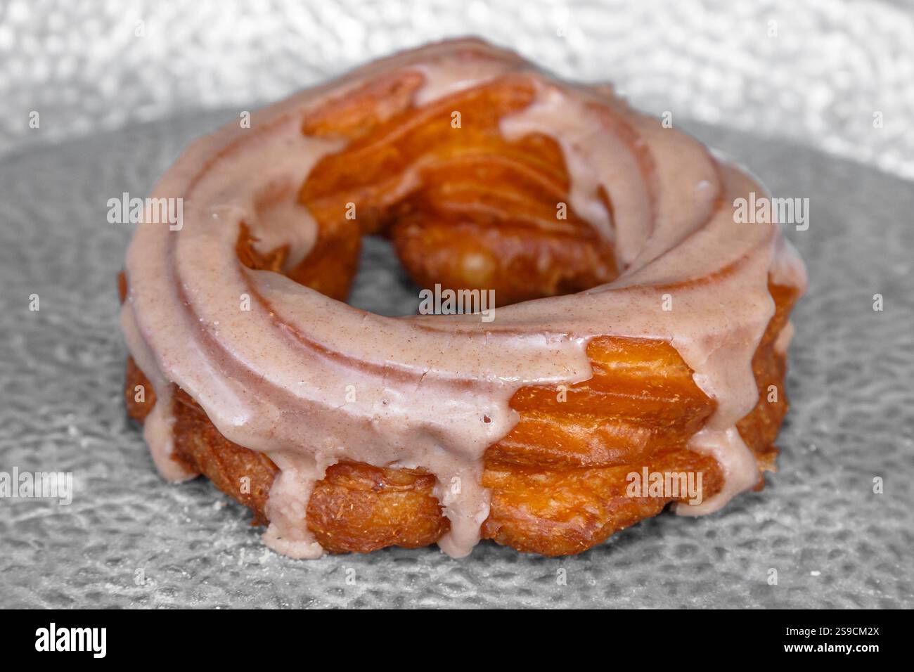 Elegant Iced Pastry Ring Captured on Metallic Gray Background in Close ...