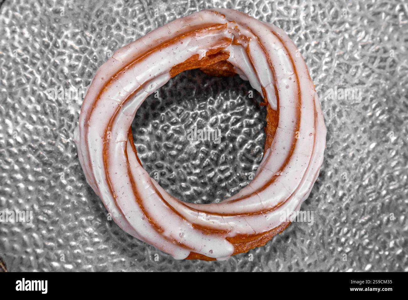 Elegant Iced Pastry Ring Captured on Metallic Gray Background in Close ...