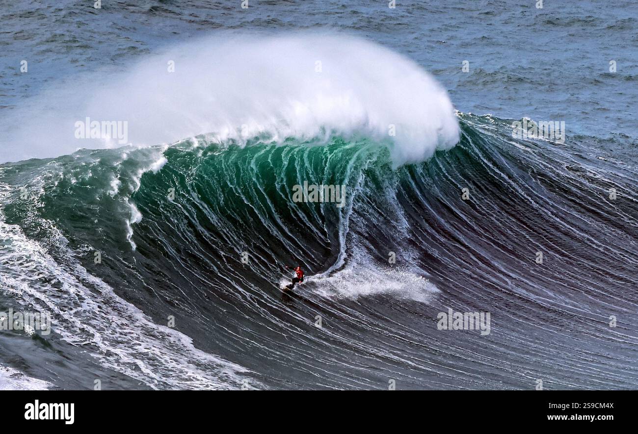 NAZARE, PORTUGAL - JANUARY 25: James Carew of Australia riding a wave ...