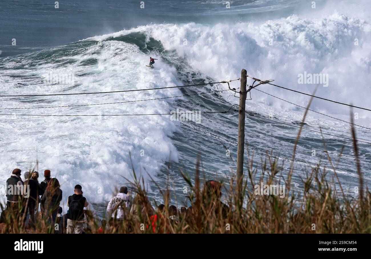 NAZARE, PORTUGAL - JANUARY 25: James Carew of Australia riding a wave ...
