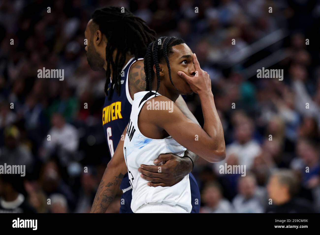 Minnesota Timberwolves guard Rob Dillingham , right, reacts after ...
